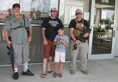 Armed residents stand guard at recruiting office | News ...