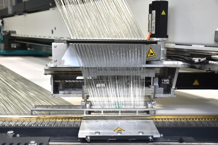 KARL MAYER unveils multiaxial glass fiber processing machine | Industry ...
