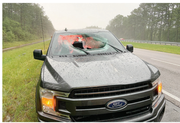 Lightning strike sends part of highway through truck windshield ...