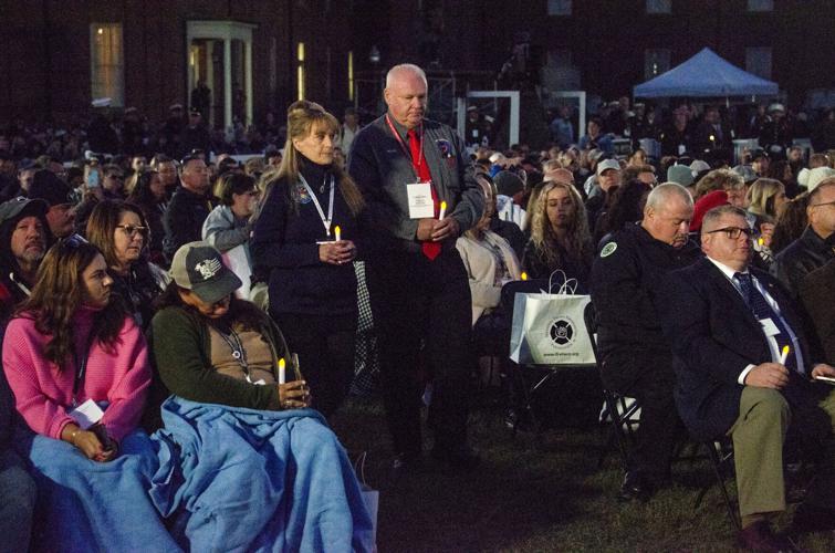 Families of 148 fallen firefighters gather for candlelight service ...