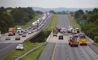 Woman survives fall from bridge as she tries to help people injured in ...