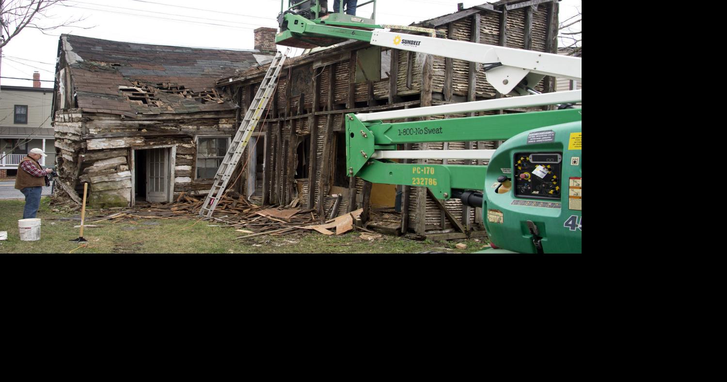 Long-awaited demolition begins on crumbling downtown cabin | Real ...