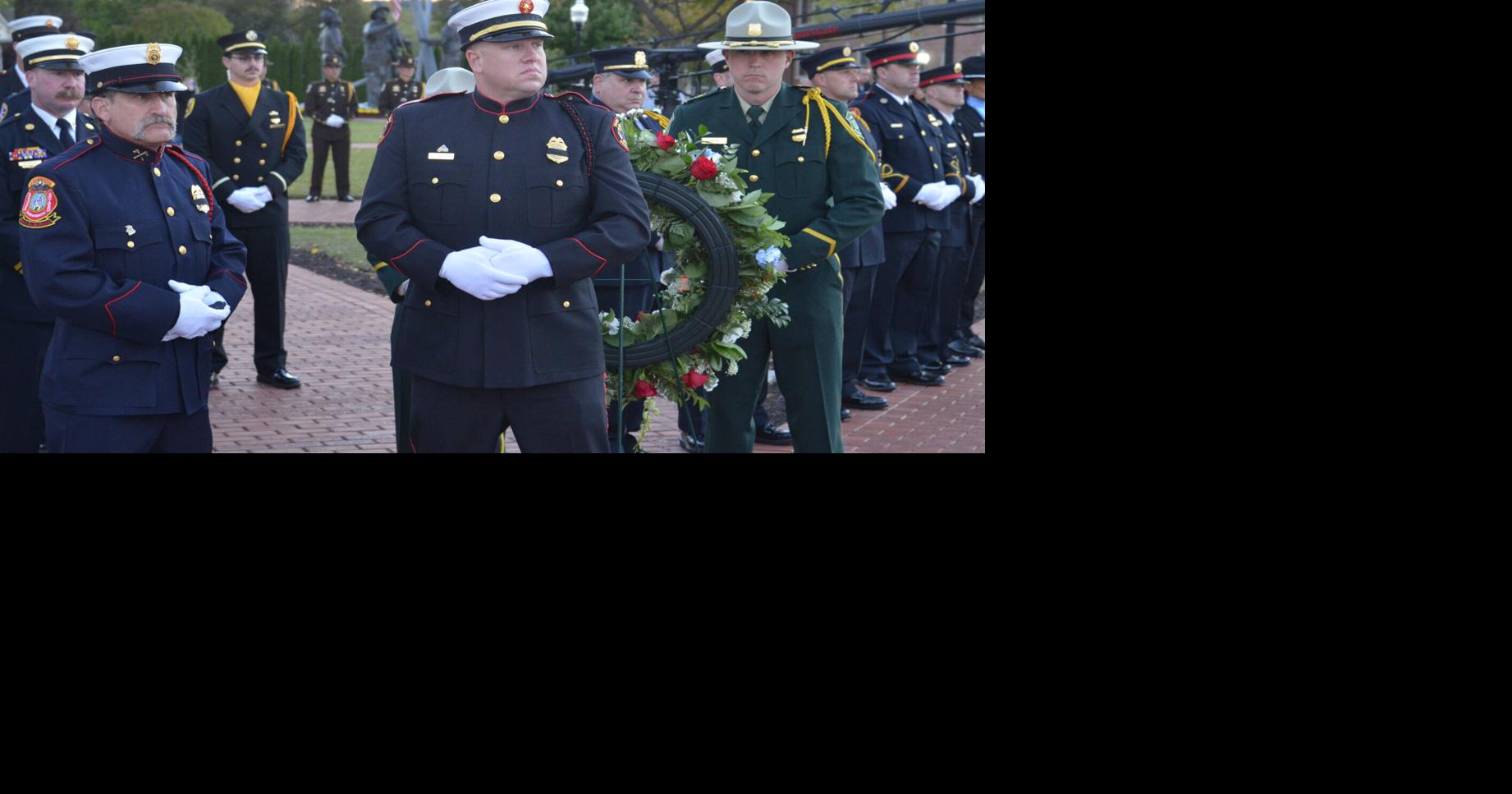Families of 148 fallen firefighters gather for candlelight service ...