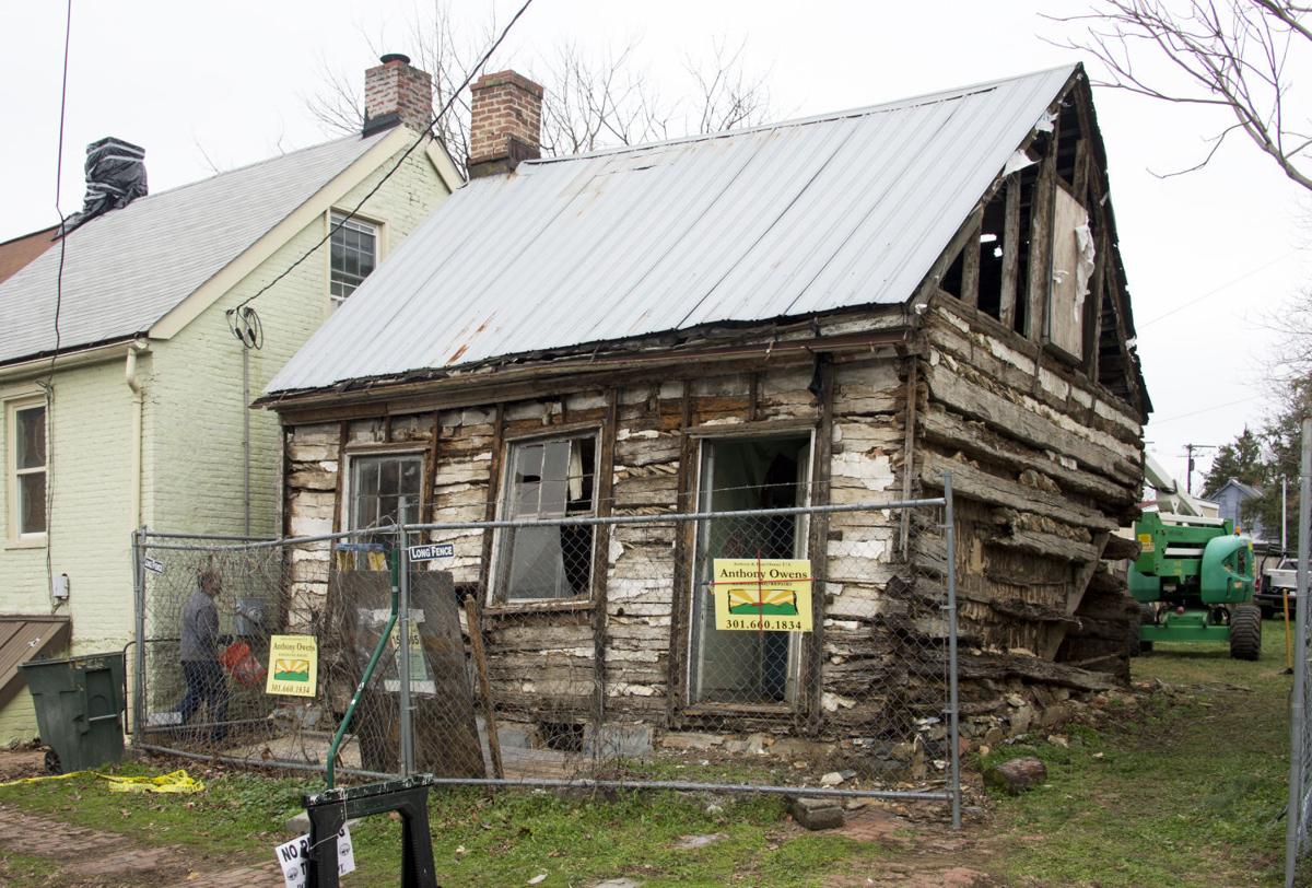 Long-awaited demolition begins on crumbling downtown cabin | Real ...