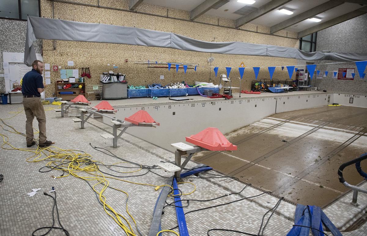 Residents wade through flooding aftermath in Frederick | Disasters ...