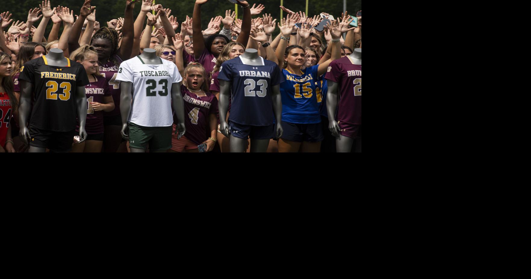 Outfitting pioneers: FCPS girls flag football teams attend uniform ...