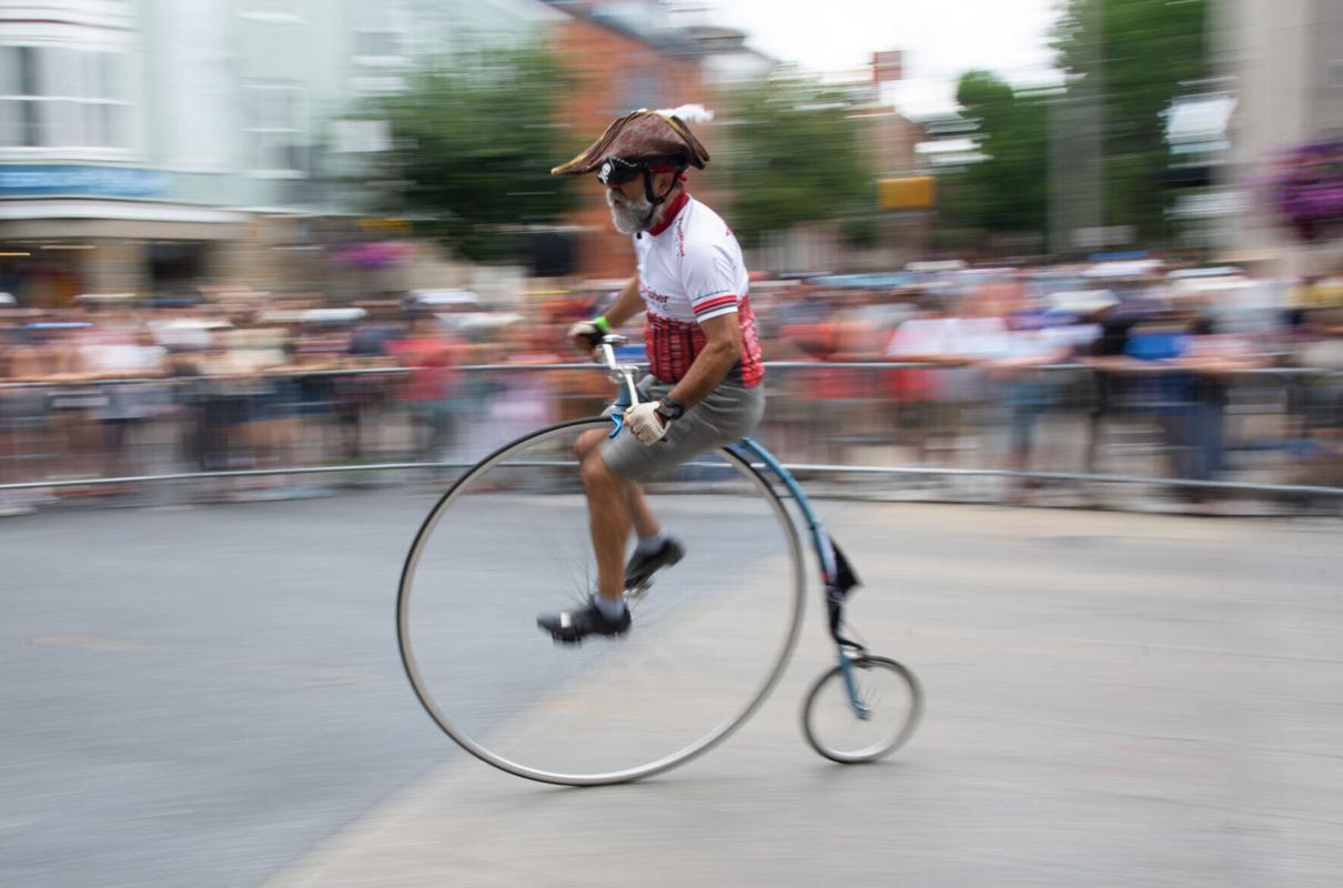 Thousands line downtown streets as high wheel racers fly past | Tourism ...