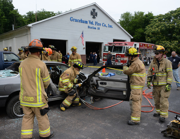 Volunteer firefighters tear cars apart in annual drill | Vehicular ...