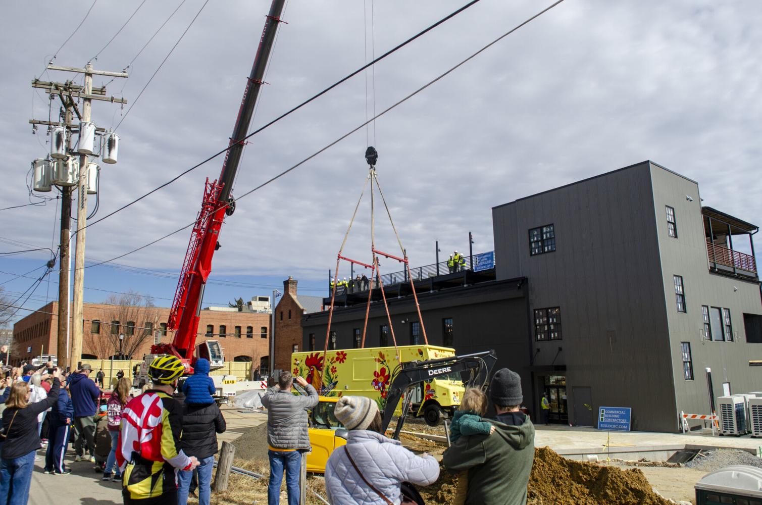Crane lifts food truck onto rooftop of new downtown Frederick ...