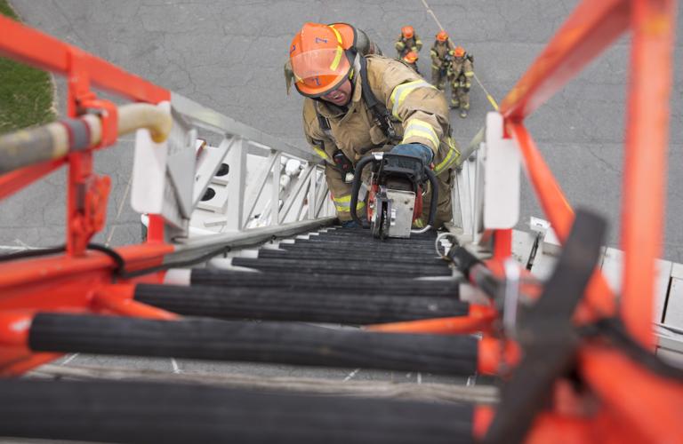 Answering the call: Recruits brave ladders in training exercise | Fire ...