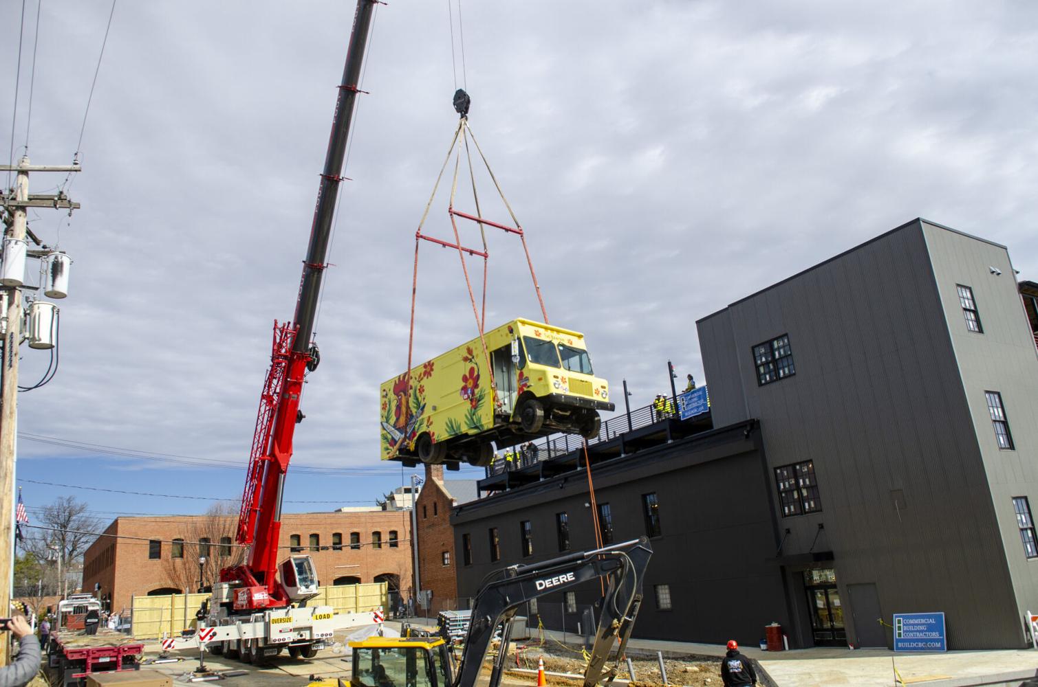 Crane lifts food truck onto rooftop of new downtown Frederick ...