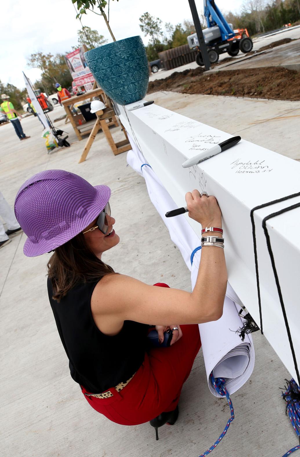 Tannos tops off $23 million office building; islander opens dream ...