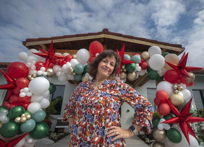 Tannos tops off $23 million office building; islander opens dream ...