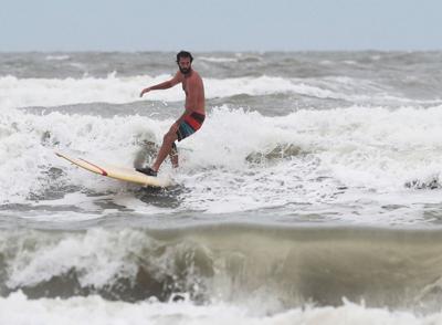 Surfers catch waves in Galveston | Local News | The Daily News