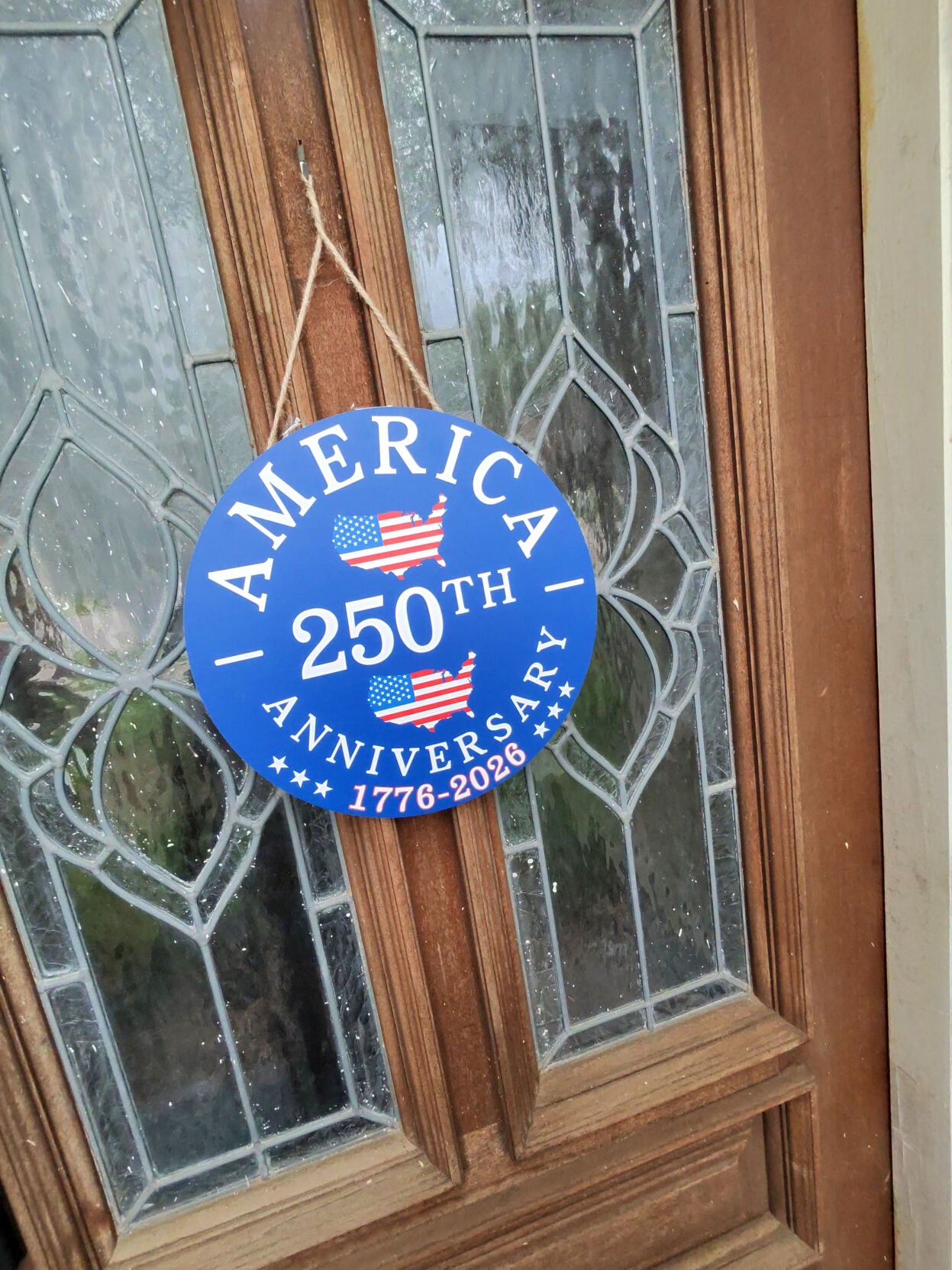 A small plaque decorates the door of a house in League City for America ...