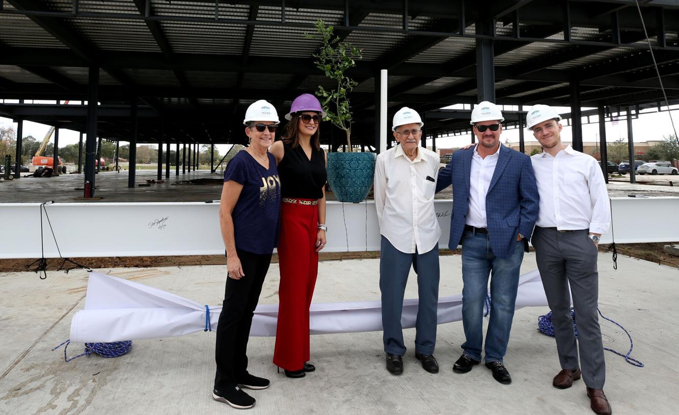 Tannos tops off $23 million office building; islander opens dream ...