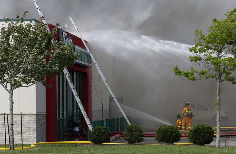 Texas City Firefighters working to put out hot spots after large fire ...