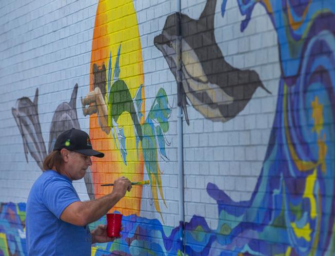 Galveston County artist creates mythical mural at the Sunshine Center ...