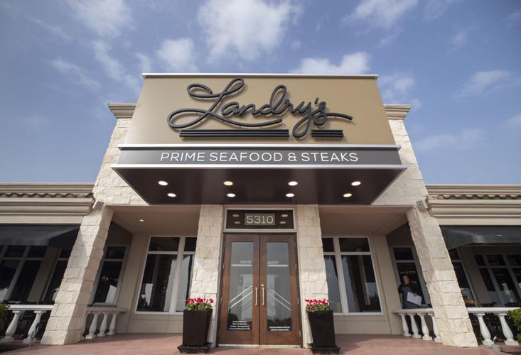 Tannos tops off $23 million office building; islander opens dream ...