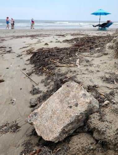 Rusted metal, concrete came with $6.8M worth of beach sand, islander ...