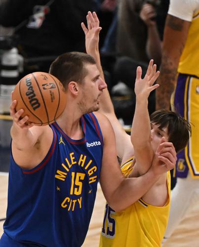 Nikola Jokics Triple Double Lifts Nuggets To Season Opening Victory