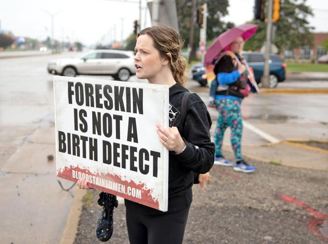 Anti-circumcision protest group The Bloodstained Men come to one of ...