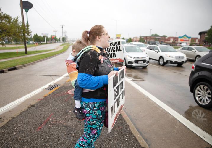 Anti-circumcision protest group The Bloodstained Men come to one of ...