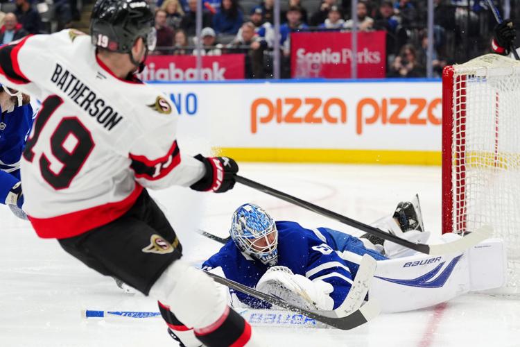 Woll earns 1st shutout of the season as Maple Leafs send Devils to ...