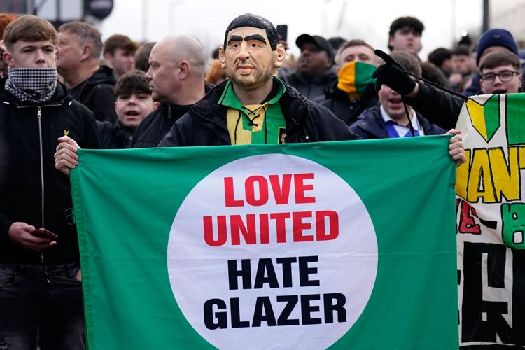 Man United fans wear clown masks in latest protest at club's owners ...