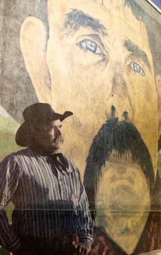 Histories: Man poses in 2003 with mural of himself painted in downtown ...