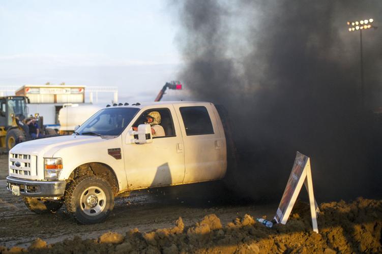 people pulling trucks