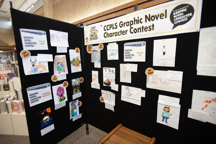 Graphic novel artists create book protectors, heroes in library ...