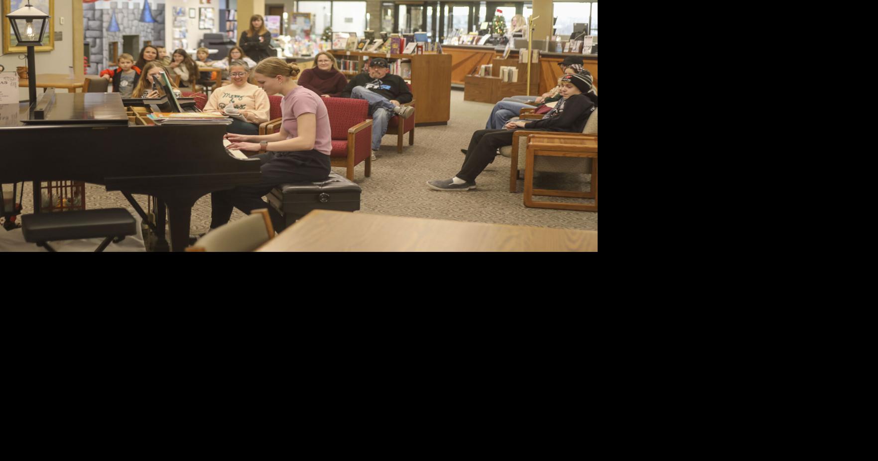 Local pianists serenade library-goers with Christmas songs | Local News ...