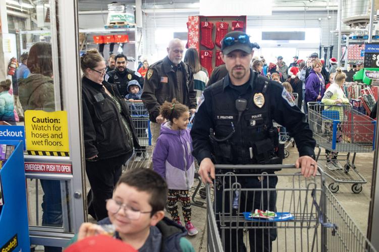 More than 50 kids from 25 families Shop with a Cop | News ...