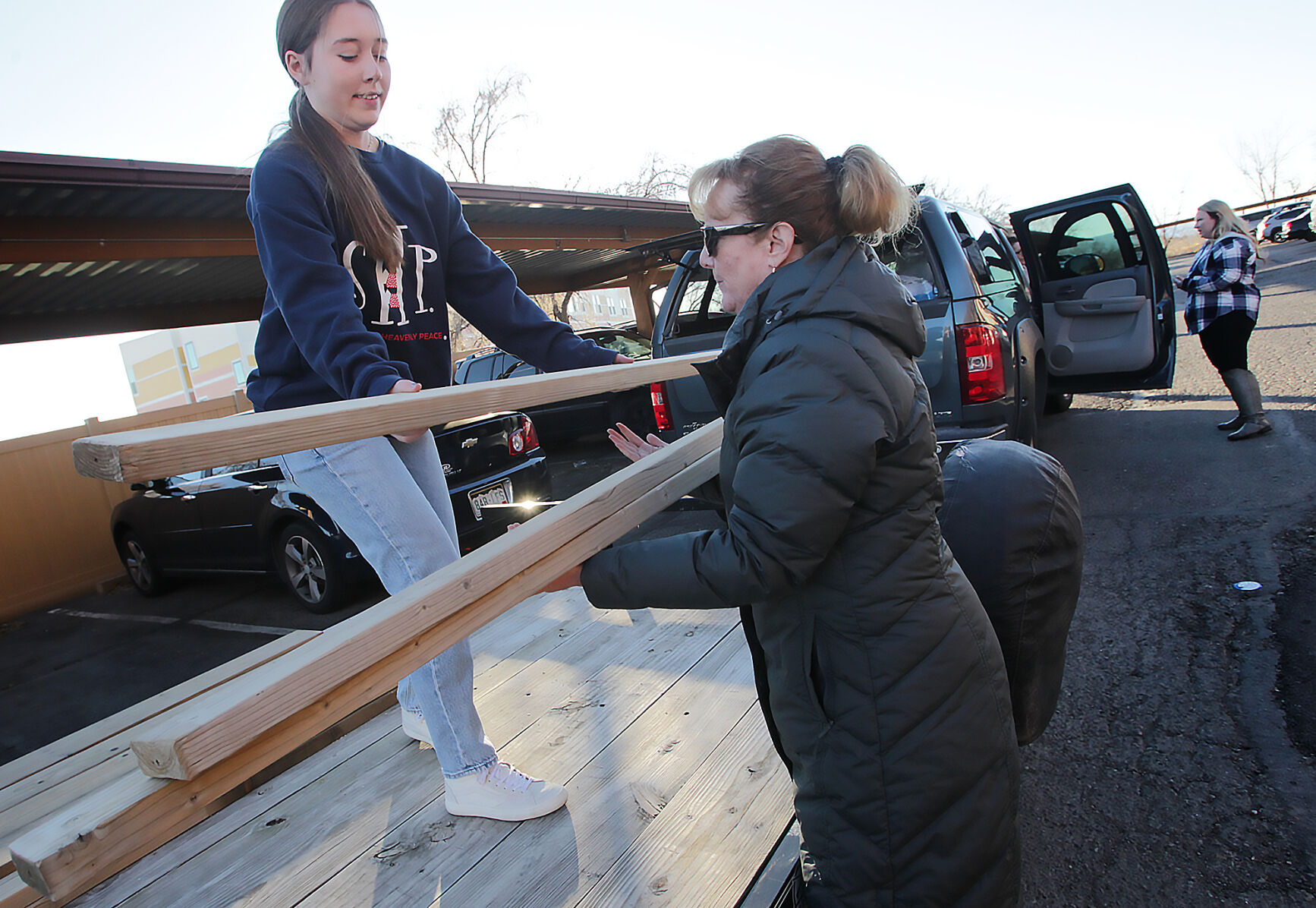 Local group aims to build community through building beds for kids ...