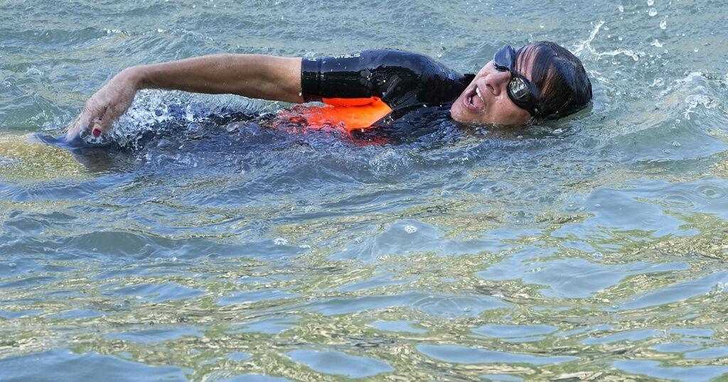Paris mayor dips into the Seine River to showcase its improved ...