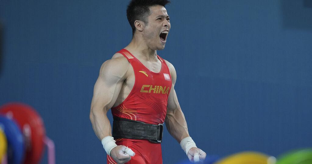 Li Fabin repeats as Olympic weightlifting champ, American Hampton ...