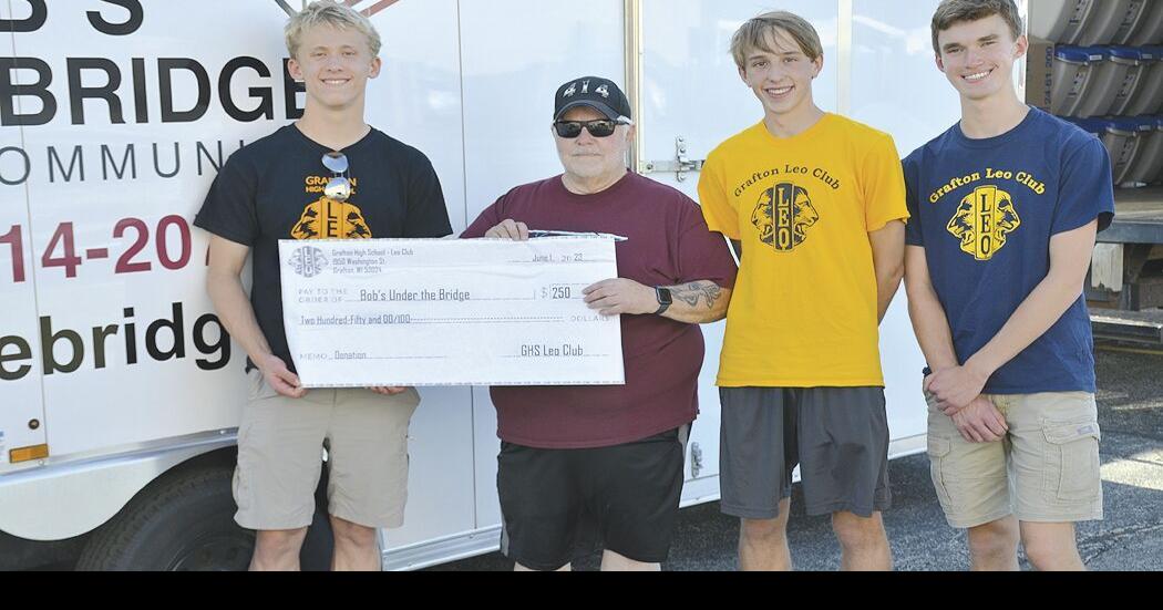Grafton Leo’s present a check to Mr. Bob’s Under the Bridge | Ozaukee ...