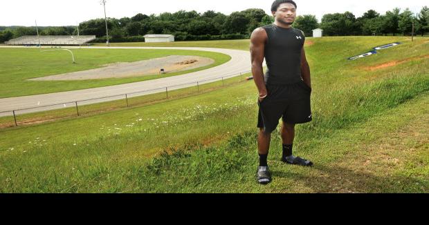 Ferrell worked past pulled hamstring for two state titles, named ...