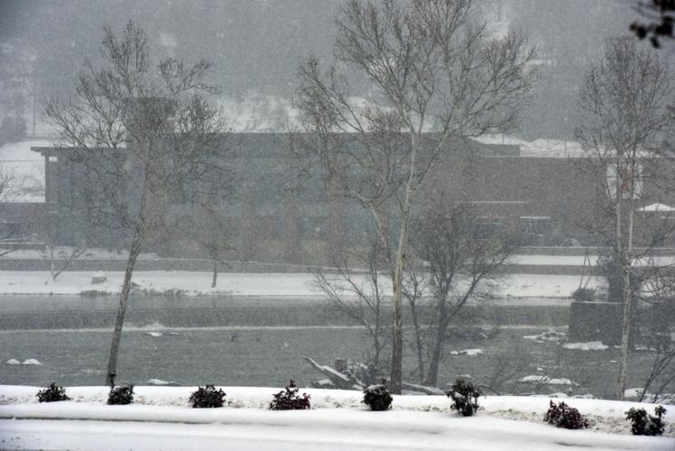 Crews work to clear roads after nearly 9 inches of snow, sleet falls in ...