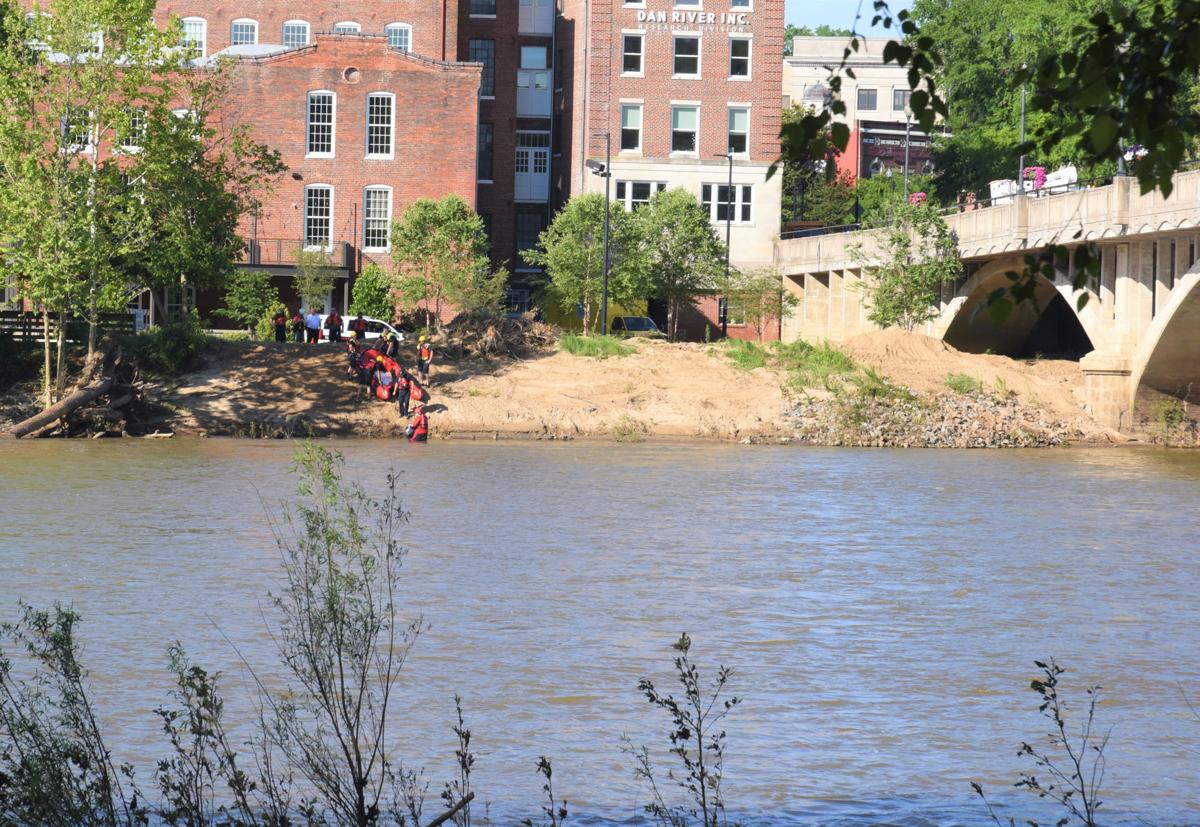 Officials rescue woman dangling from Danville bridge