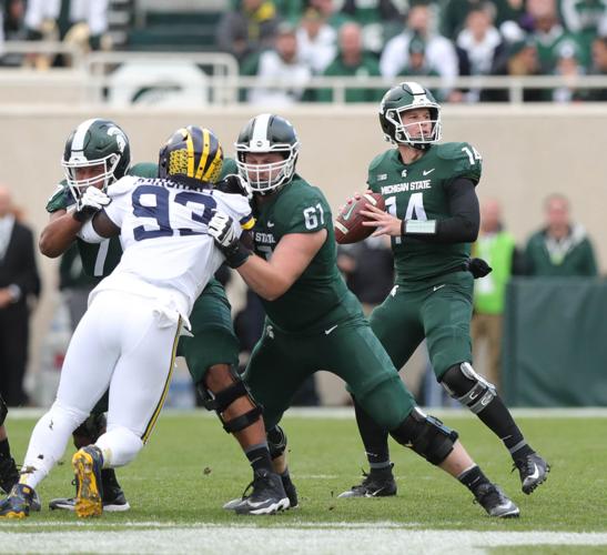 Michigan football powers through rival Michigan State in emotional ...