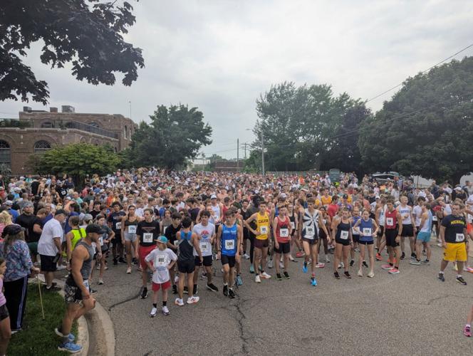 Rain fails to dampen record turnout at Coast Guard City USA Run ...