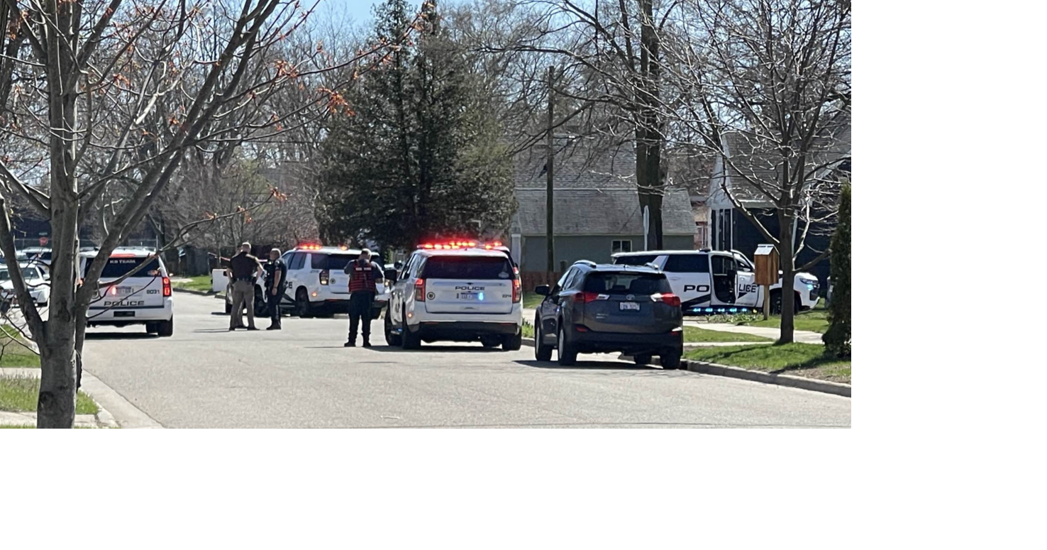 Suspect in custody after man is shot in the head, bomb threat made in ...