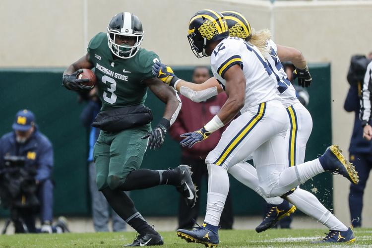 Michigan football powers through rival Michigan State in emotional ...