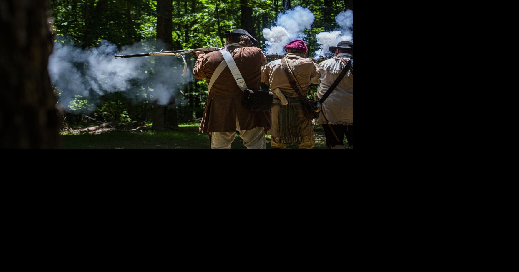 Reenactors demonstrate musket fire