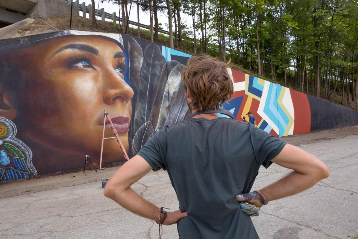 Australian street artist creates murals in Greensboro