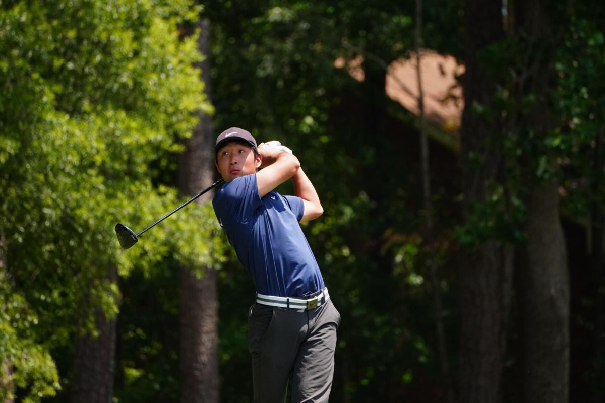 Defending champion Henry Guan's 64 puts him in the lead at Wyndham Invitational