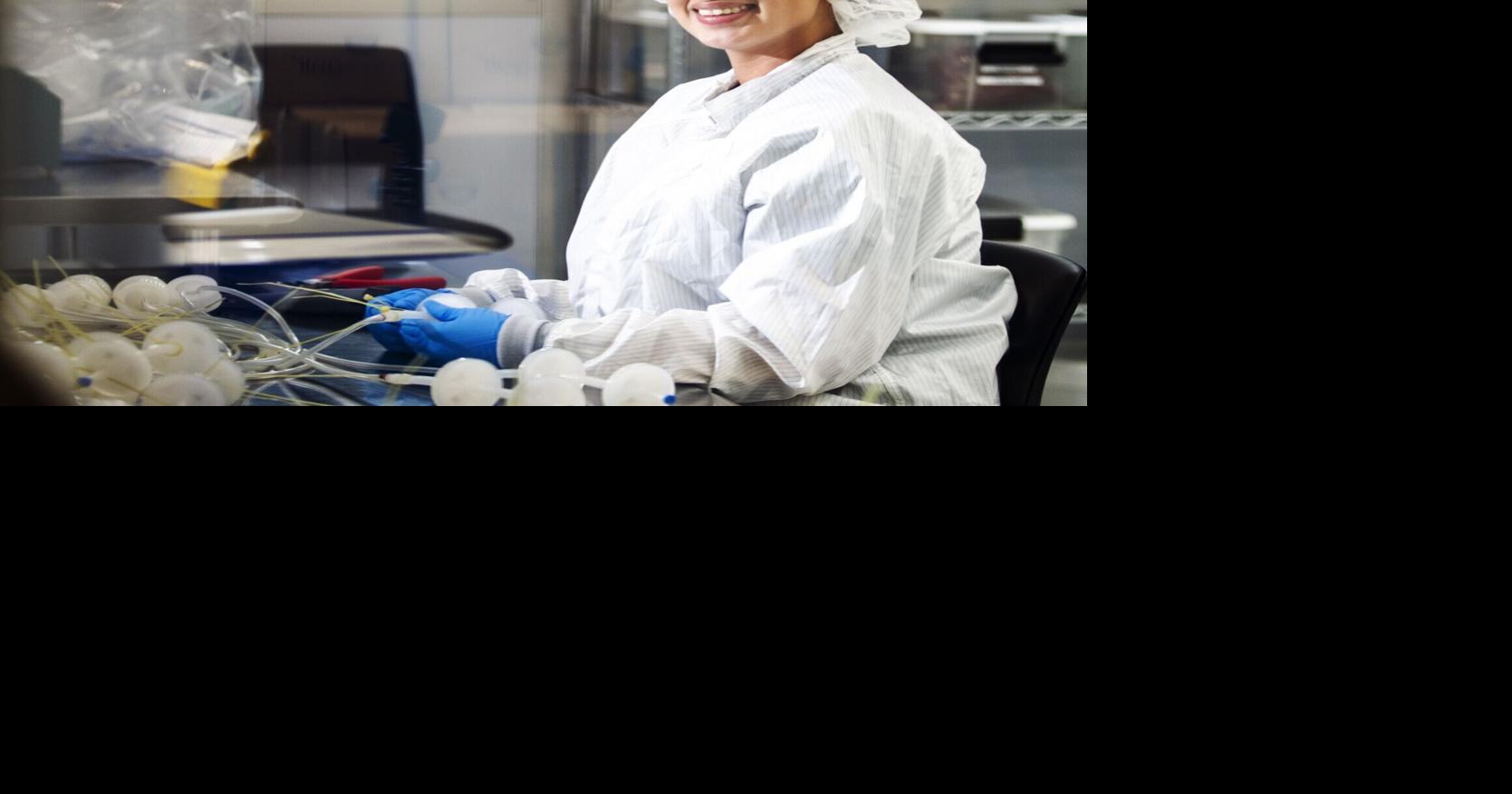 Clean room worker assembles medical devices in Greensboro