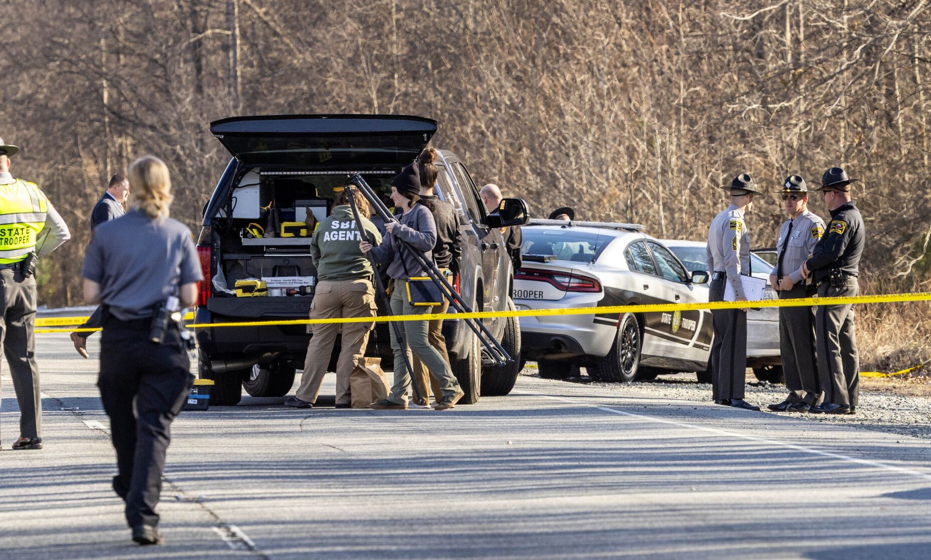 Woman with gun shot by state trooper in Greensboro
